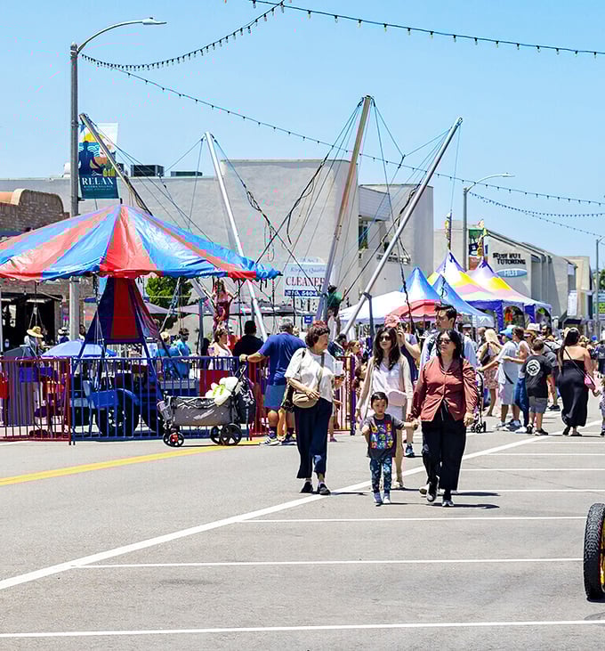 Summer festivals transform parking lots into wonderlands of bounce houses and funnel cakes—childhood joy with adult supervision.