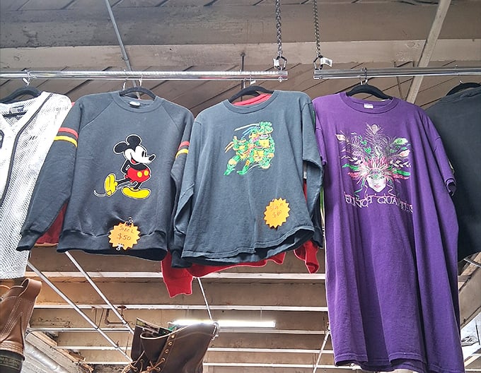 Vintage tees that scream '90s nostalgia. That Ninja Turtles shirt has seen things—probably a lot of Pizza Hut and Saturday morning cartoons.