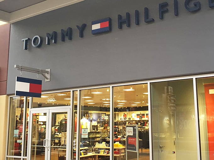 Tommy Hilfiger's iconic red, white, and blue signals American casual classics. The window displays silently whisper, "Yes, you do need another polo shirt."
