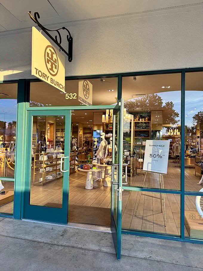 Tory Burch's turquoise doors beckon like a tropical vacation for your credit card. That 50% off sign is speaking my language.