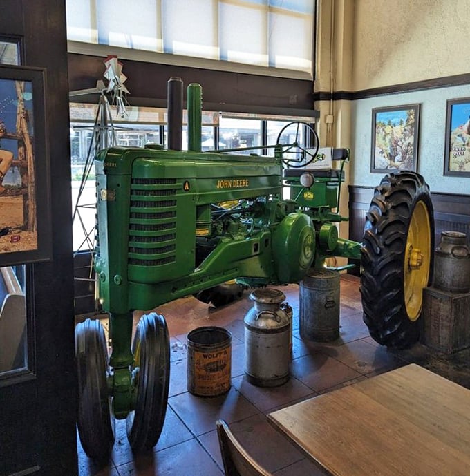 A vintage John Deere tractor pays homage to Gilbert's agricultural roots, reminding diners that great food always begins in the field.