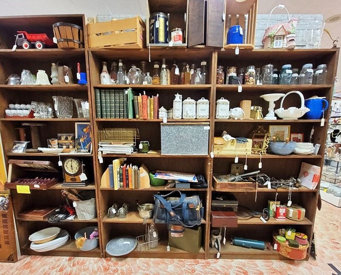 The ultimate collector's shelf—where vintage bottles, classic books, and yesterday's kitchenware create a museum of everyday American life.