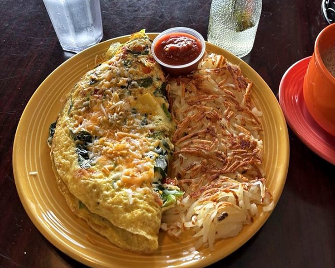 An omelet and hash browns in perfect harmony—like Simon and Garfunkel if they were breakfast foods instead of folk singers.