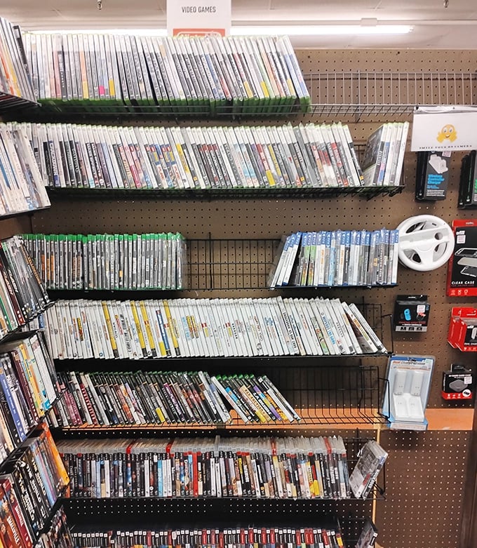 Video game nostalgia by the shelf-full. Each plastic case contains worlds where you once spent hours before responsibilities like mortgages and lawn care existed.