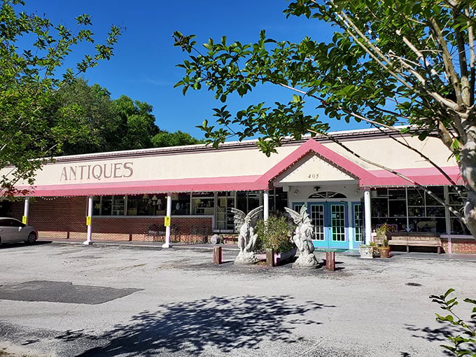 The Village Antique Mall welcomes treasure hunters with guardian angels at the entrance. Your wallet may need their protection inside!