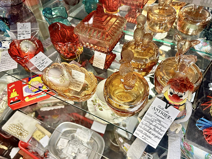 Depression glass catches the light like liquid amber – each piece a survivor of economic hardship transformed into collectible beauty.