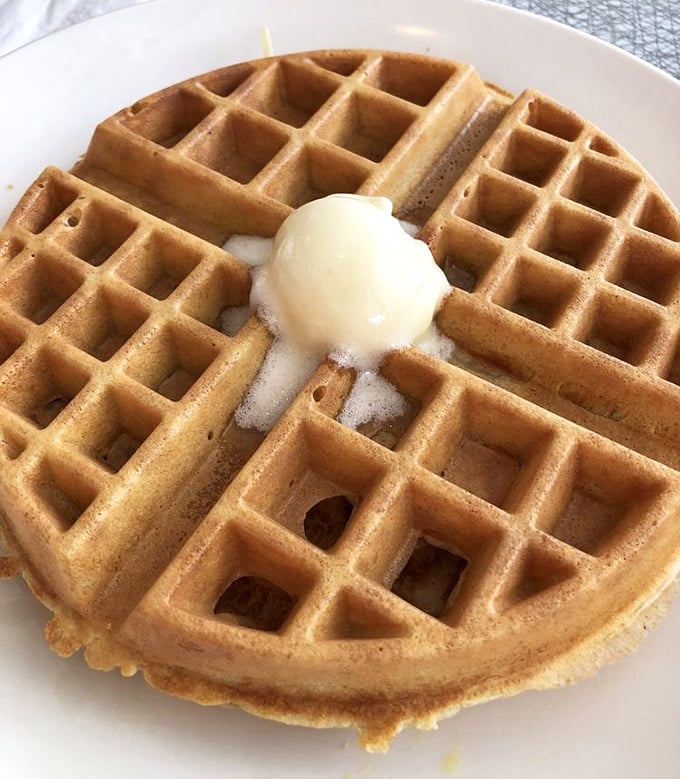 This waffle's perfect grid pattern isn't just satisfying—it's creating little pools of butter and syrup that make mathematicians and food lovers equally happy.