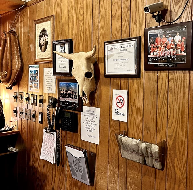 Every steakhouse needs its personality wall – awards, memorabilia, and that quintessential bull skull watching over diners like a benevolent spirit.