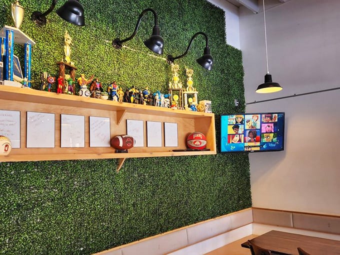 The green wall display shelf showcases trophies and memorabilia—evidence that chicken domination doesn't happen by accident.