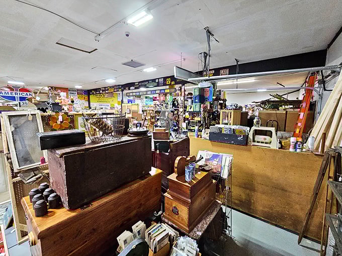 Organized chaos is an art form here – wooden furniture, vintage signs, and mysterious boxes create a three-dimensional "I Spy" game for adults.