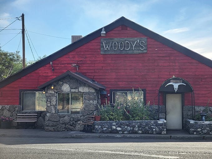 Woody's red barn exterior isn't trying to be trendy—it achieved authentic rustic charm long before Brooklyn restaurants started charging extra for it.