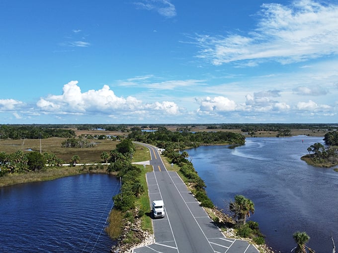 A road that splits the water like Moses himself designed it – Yankeetown's boat ramp area offers postcard views without the postcard crowds.