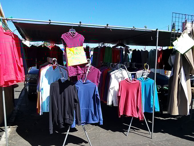 Simple racks under blue skies showcase everyday fashion – proof that style doesn't need marble floors or fancy lighting.