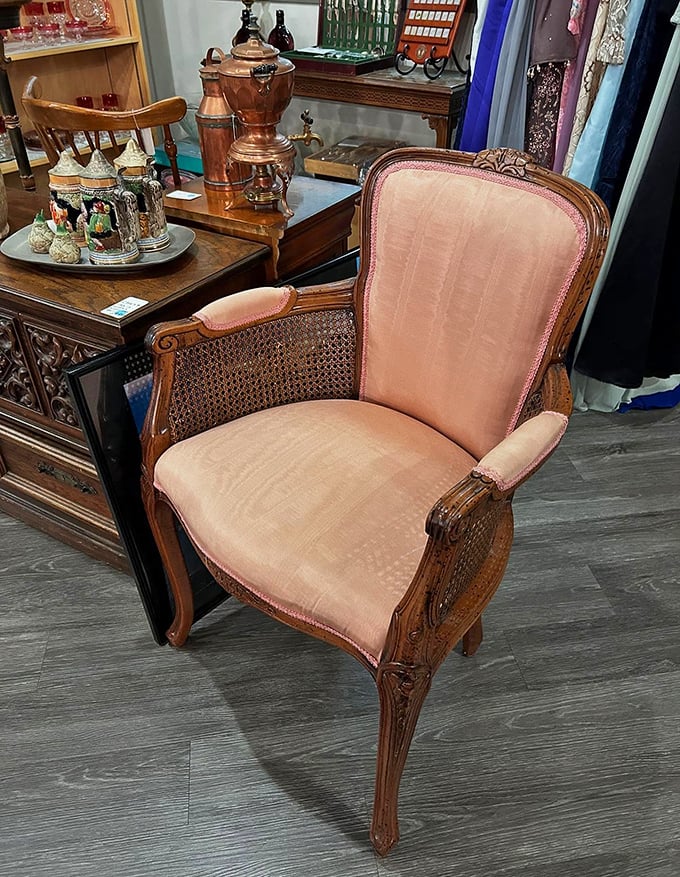 This elegant pink armchair isn't just seating—it's a throne waiting for its next monarch of cozy reading sessions.