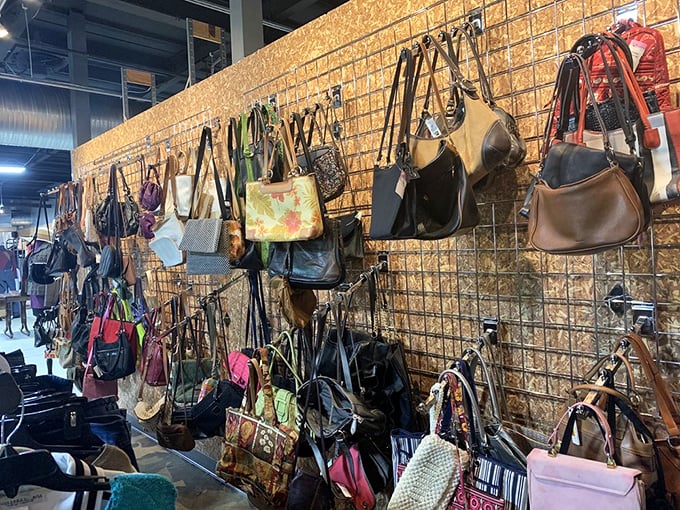 The handbag wall: where designer dreams meet budget realities. That Coach purse you've been eyeing? It might be hiding right here.