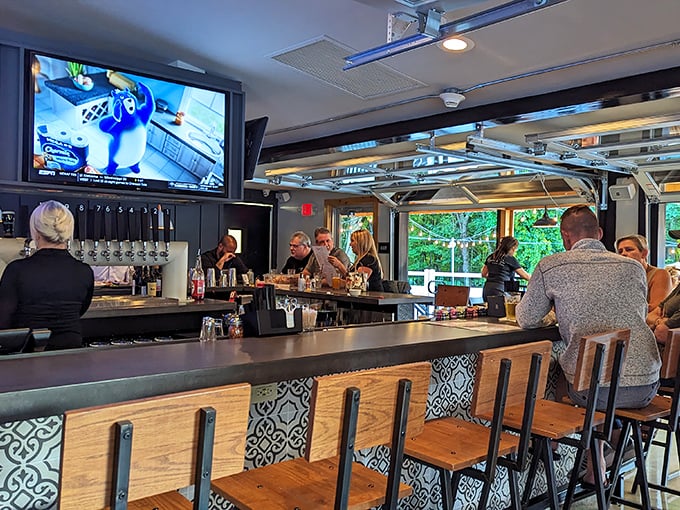 The bar area—where sports fans, cocktail enthusiasts, and food lovers find common ground amid the gentle clinking of glasses and friendly banter.