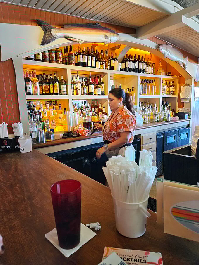A bar adorned with trophy fish that seem to say, "Trust us, the seafood here is the real deal."