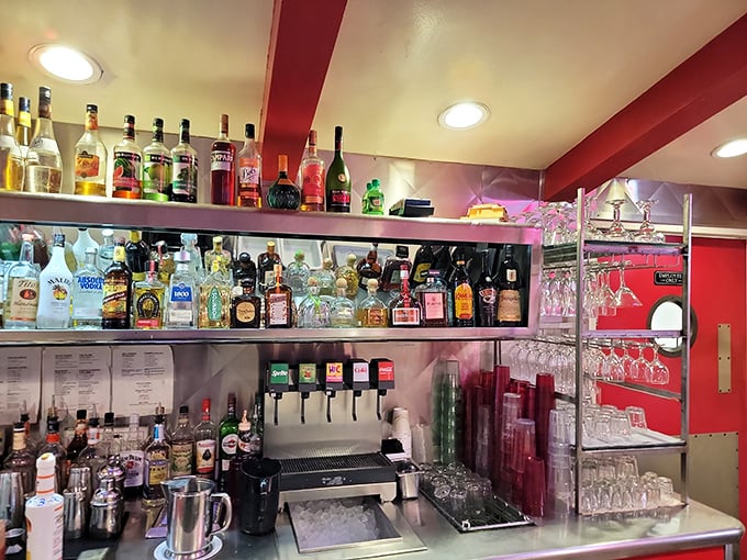 This isn't just a bar—it's liquid history. Where else can you sip something spirited while surrounded by enough red vinyl to upholster a Cadillac?