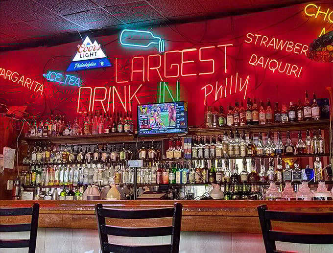 "Largest Drink in Philly" isn't just neon bragging—it's a challenge. The bar side of Max's offers liquid courage before tackling their massive sandwiches.