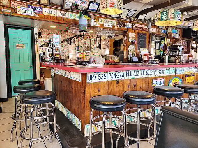 Where license plates meet bar stools in perfect harmony. This counter has heard more fishing tales than any boat captain in the Keys.