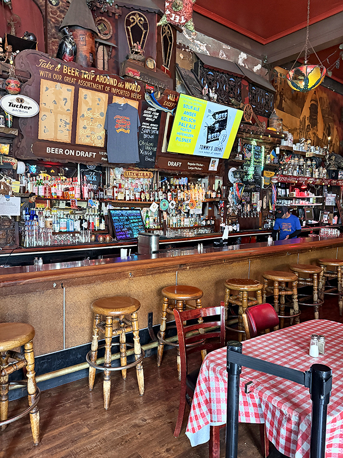 The bar at Tommy's isn't trying to reinvent mixology—it's a shrine to straightforward drinking where bartenders pour with purpose and the beer is always cold.