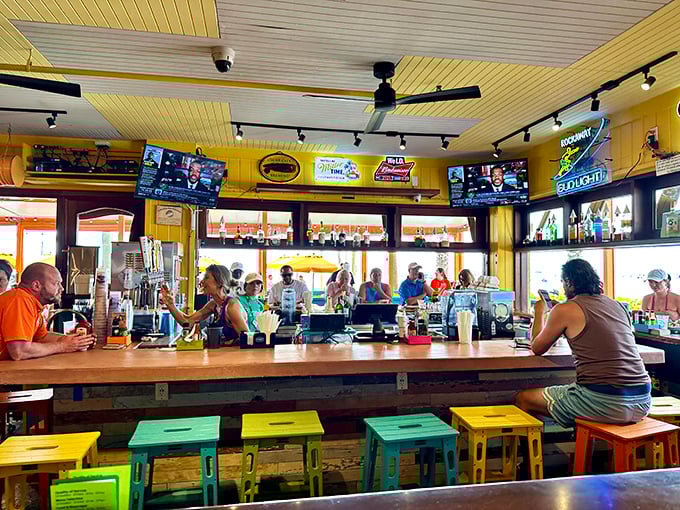 The bar isn't just serving drinks; it's serving community—a colorful gathering spot where strangers become friends over grouper tales and rum runners.