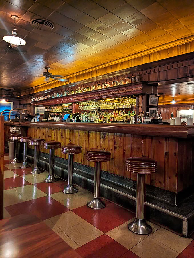 The bar stools await their next patrons, each one a front-row seat to the timeless theater of American steakhouse tradition.