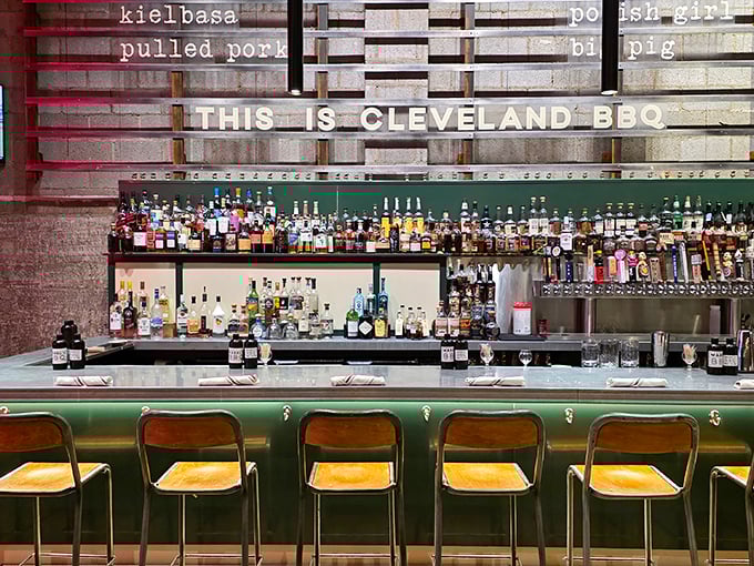 Behind that bar lies liquid courage for those about to tackle the Giant Beef Rib. "THIS IS CLEVELAND BBQ" isn't just signage—it's a declaration.
