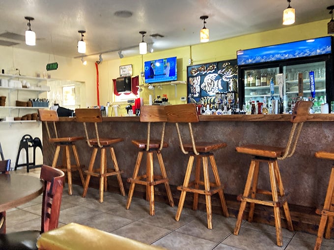 The bar area—where early birds perch with coffee and late risers contemplate a Bloody Mary. Wooden stools have heard every local story worth telling.