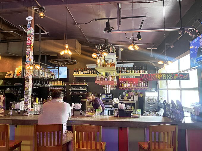 The bar isn't just serving drinks—it's creating liquid art in a space where even the stickers and bottles become part of the masterpiece.