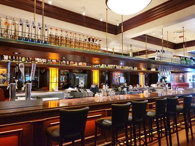 The bar at Pappadeaux—where bottles line up like soldiers ready for cocktail duty and bartenders work their liquid magic.