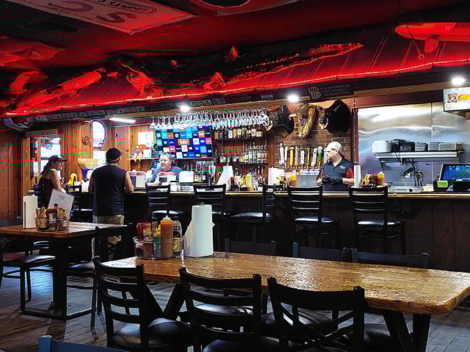 The bar area serves as command central – where orders fly, stories flow, and the bartenders remember your usual before you've fully settled onto your stool.