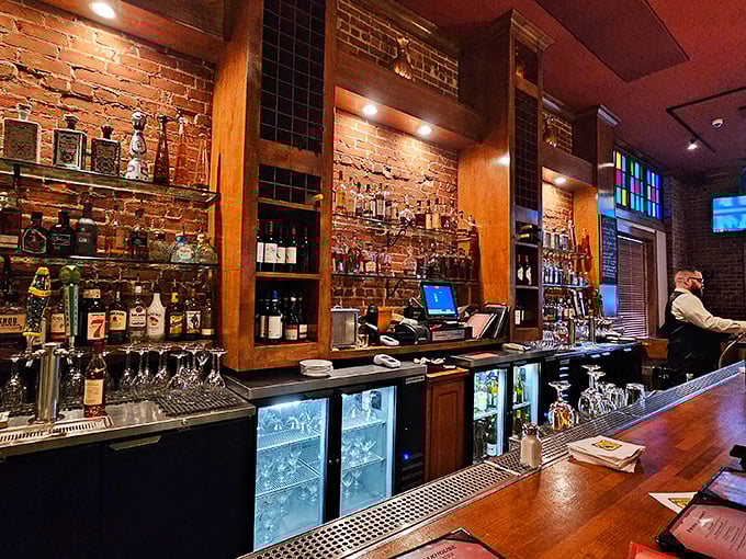 The bar isn't just serving drinks; it's a liquid library with wooden shelves holding volumes of spirits for every mood.