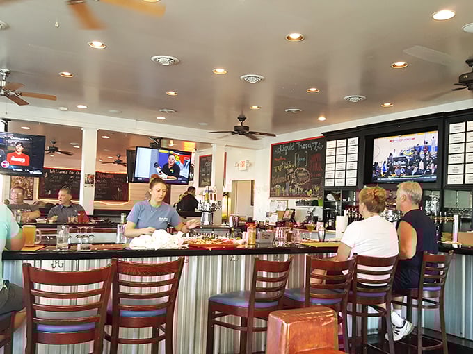 The bar—where seafood stories get taller and cocktails flow like the tide. Those stools have heard more fish tales than a marine biologist's diary.
