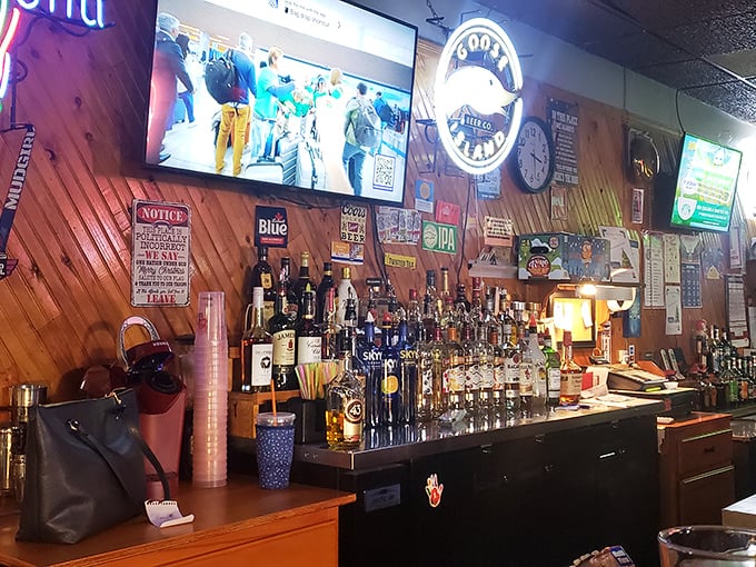 The bar gleams with promise under the glow of neon beer signs—bottles standing at attention like sentinels guarding good times.