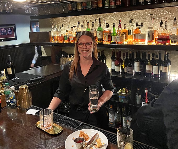 A bar stocked with liquid happiness, where skilled hands craft the perfect prelude to your steak adventure.