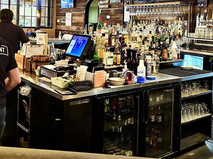 A bar stocked for serious business. Bottles stand at attention like soldiers, ready to be deployed for your drinking pleasure.