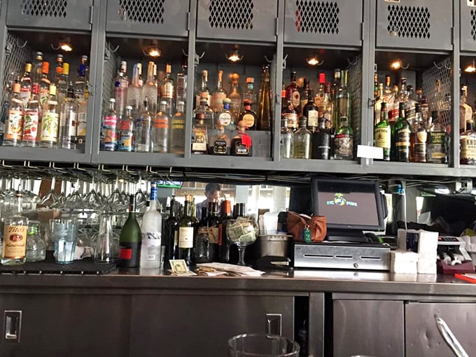 The bar at Big Pink doesn't whisper "craft cocktails"—it shouts "we've got everything you need" with the confidence of someone who knows exactly what you're craving.