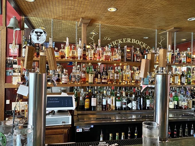 Behind this bar, bottles stand like soldiers ready for duty, promising libations that pair perfectly with that legendary fish and chips.