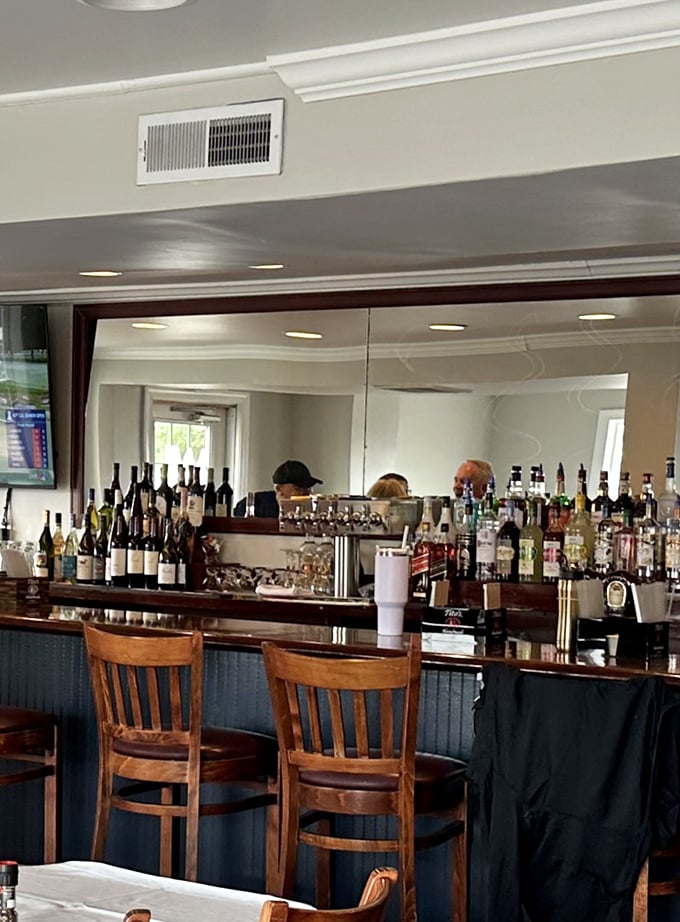 The bar at Waterman's isn't just serving drinks—it's dispensing liquid courage for those about to battle mountains of crab legs.