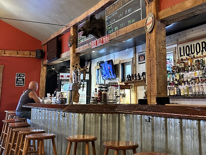The bar where barbecue stories are exchanged like currency. Notice the corrugated metal – practical and somehow exactly right for this temple of smoke.