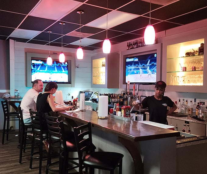 The bar area: where sports on TV and handcrafted cocktails create the perfect storm of contentment. A sanctuary for both solo diners and social butterflies.