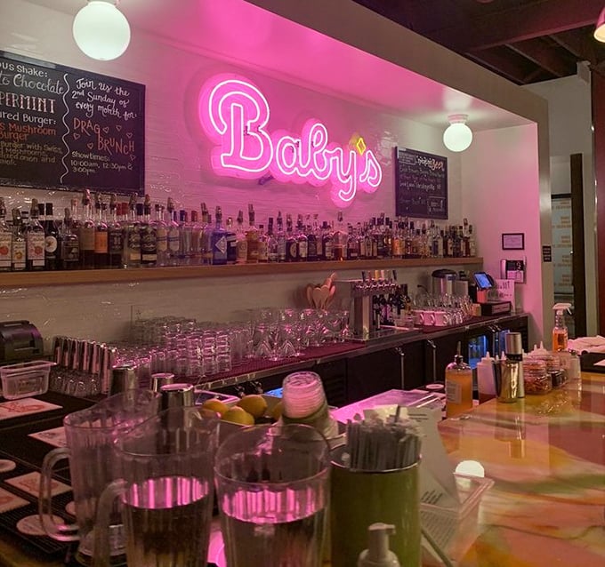 The bar's pink neon glow transforms ordinary cocktail hour into something that feels both nostalgic and thoroughly modern – like vinyl records played through Bluetooth.