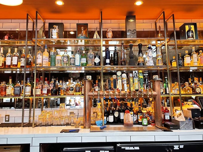 A bar shelf so meticulously organized it could make Marie Kondo weep with joy. Every bottle sparks joy – especially after 5pm.