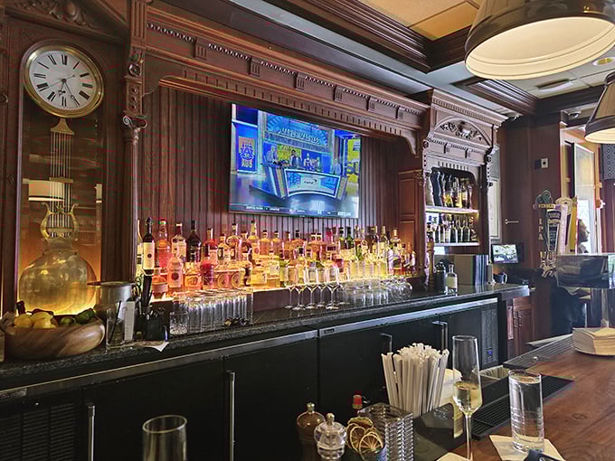 The bar area looks like it was designed by a sea captain with excellent taste—dark wood, gleaming bottles, and the promise of maritime tales.