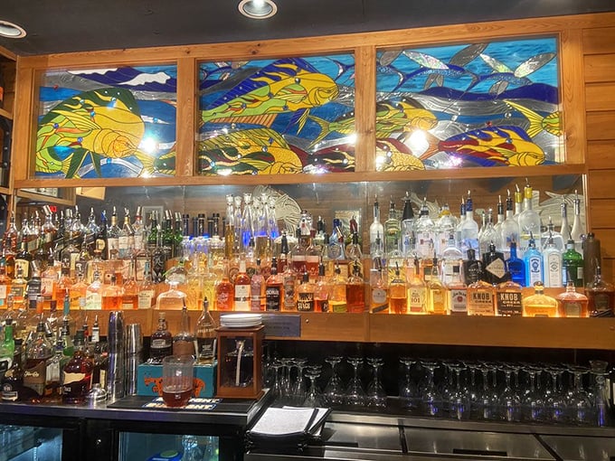 Behind gorgeous stained glass fish swims a sea of spirits. This bar doesn't just serve drinks—it tells stories through bottles and bartenders.