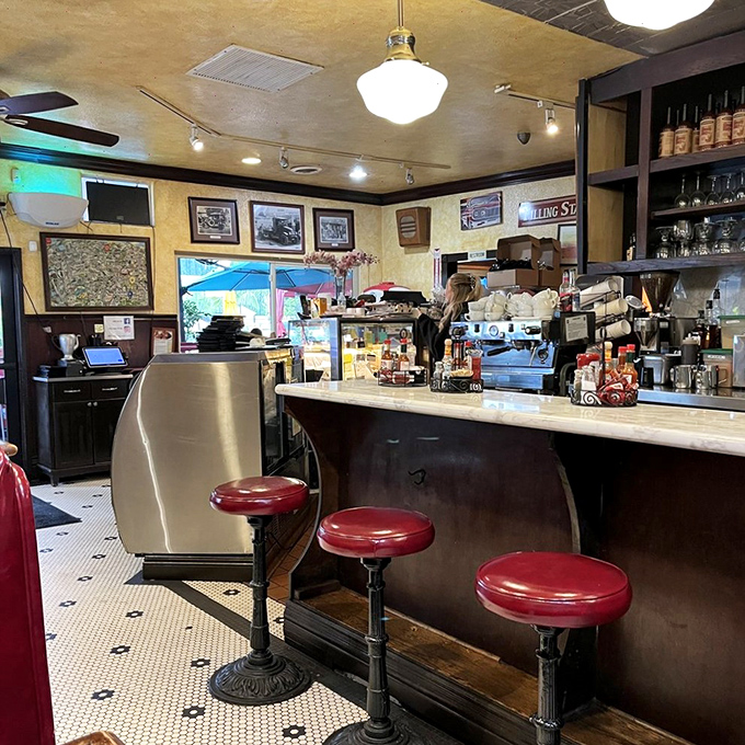 The counter beckons early birds with its classic red stools—the perfect spot to sip coffee and watch breakfast magic unfold.