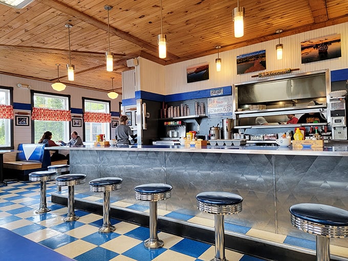 The counter where magic happens—stainless steel gleaming under wooden ceilings, promising delicious possibilities with every order placed.