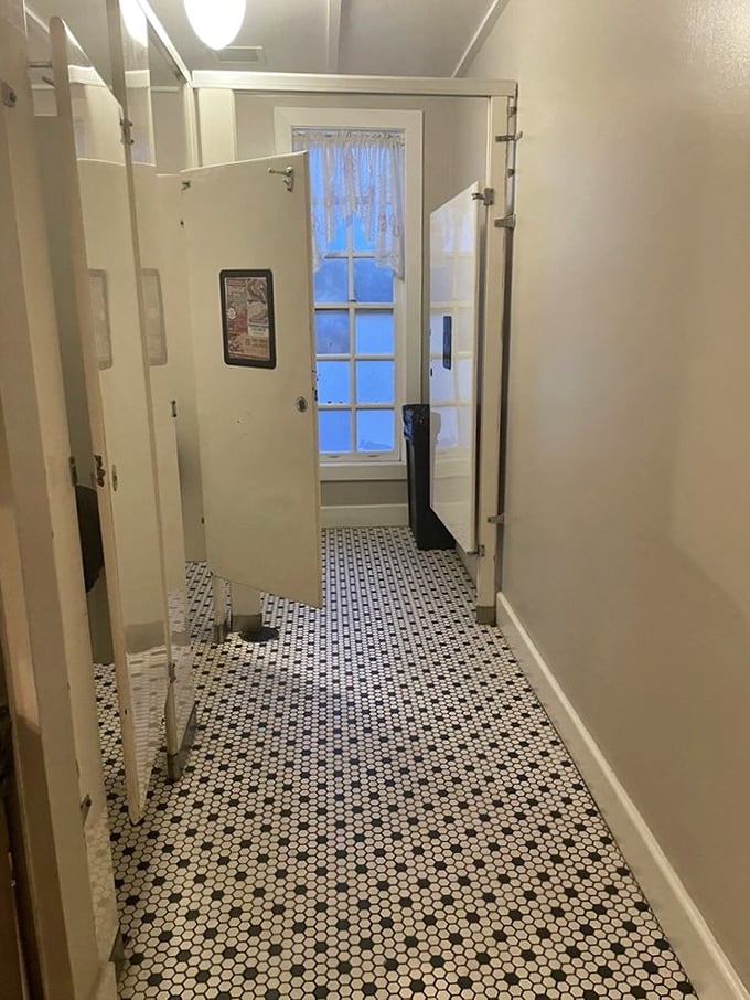 The restroom hallway's vintage tile floor—because at Loveless, even the walk to wash your hands is steeped in nostalgic charm.