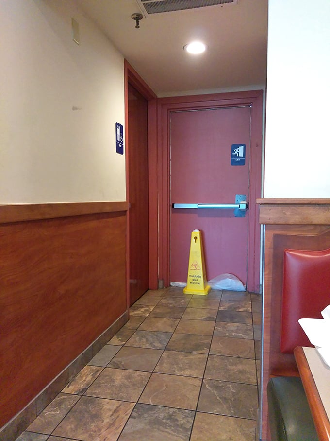 Even the hallway to the restrooms maintains that classic diner aesthetic. No pretentious design elements here—just honest materials that have witnessed decades of satisfied customers.